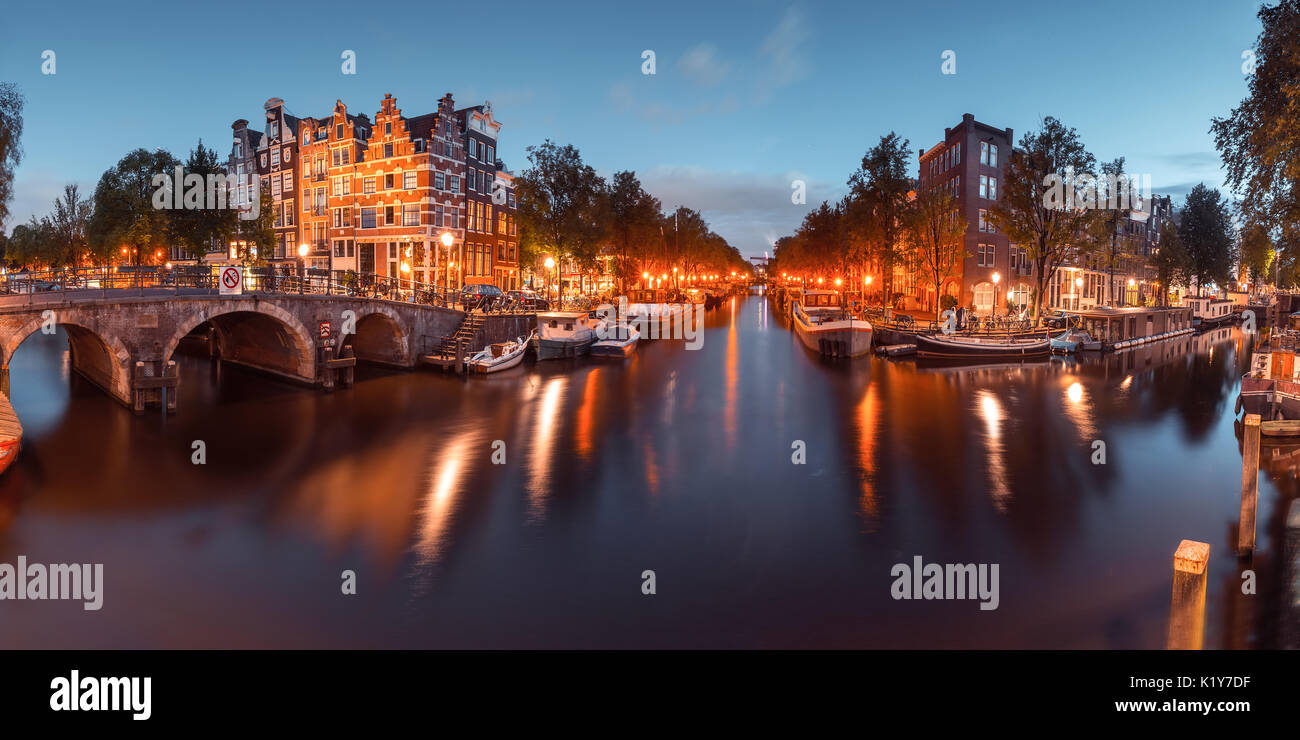 Night city view of Amsterdam canal and bridge Stock Photo - Alamy