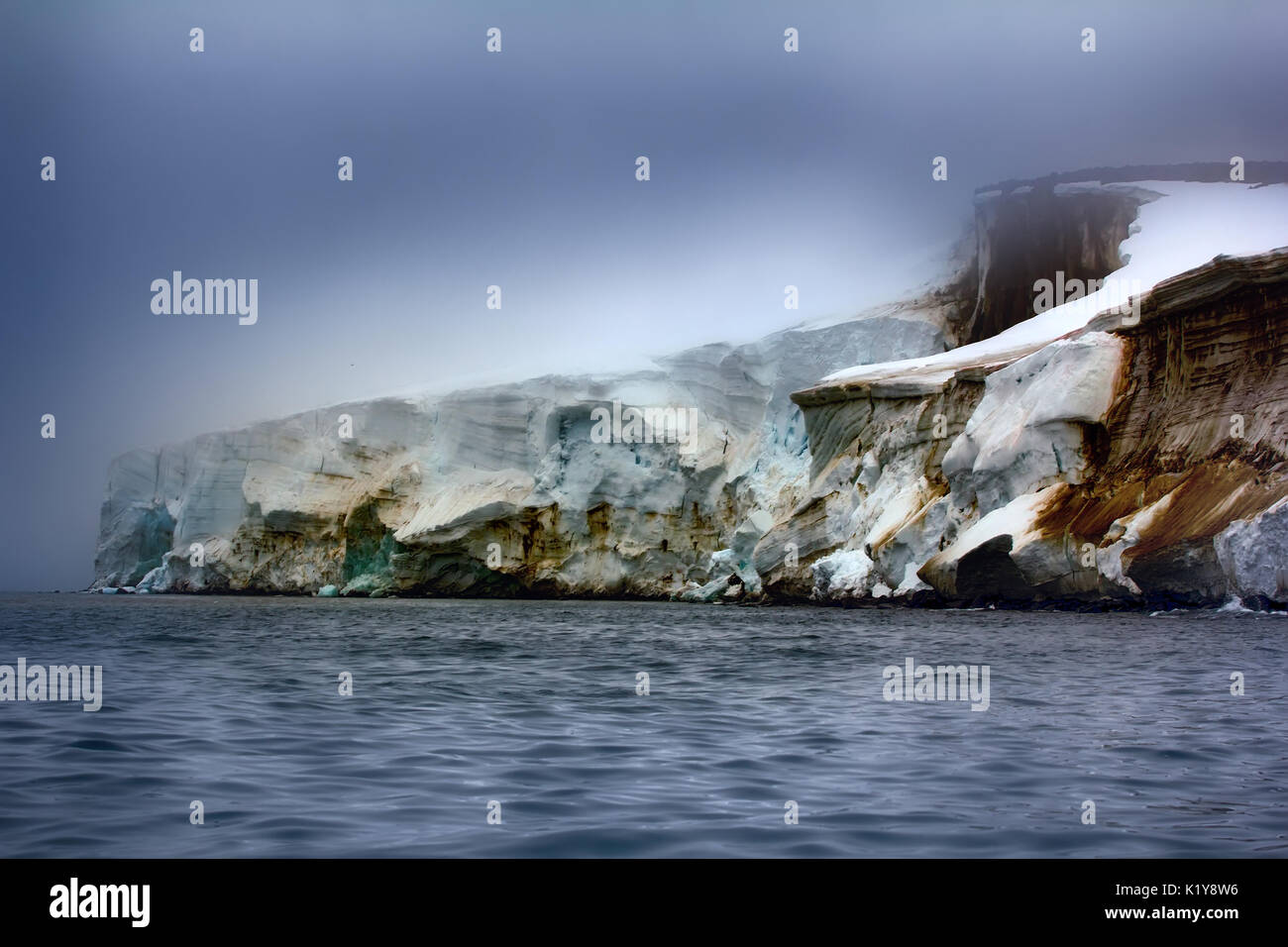 Harsh appeal of Arctic. Columnar rocks, cliffs, glaciers and snowfields ...