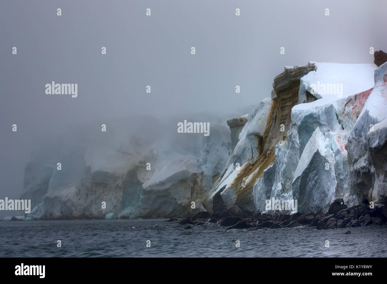 Harsh appeal of Arctic. Columnar rocks, cliffs, glaciers and snowfields ...