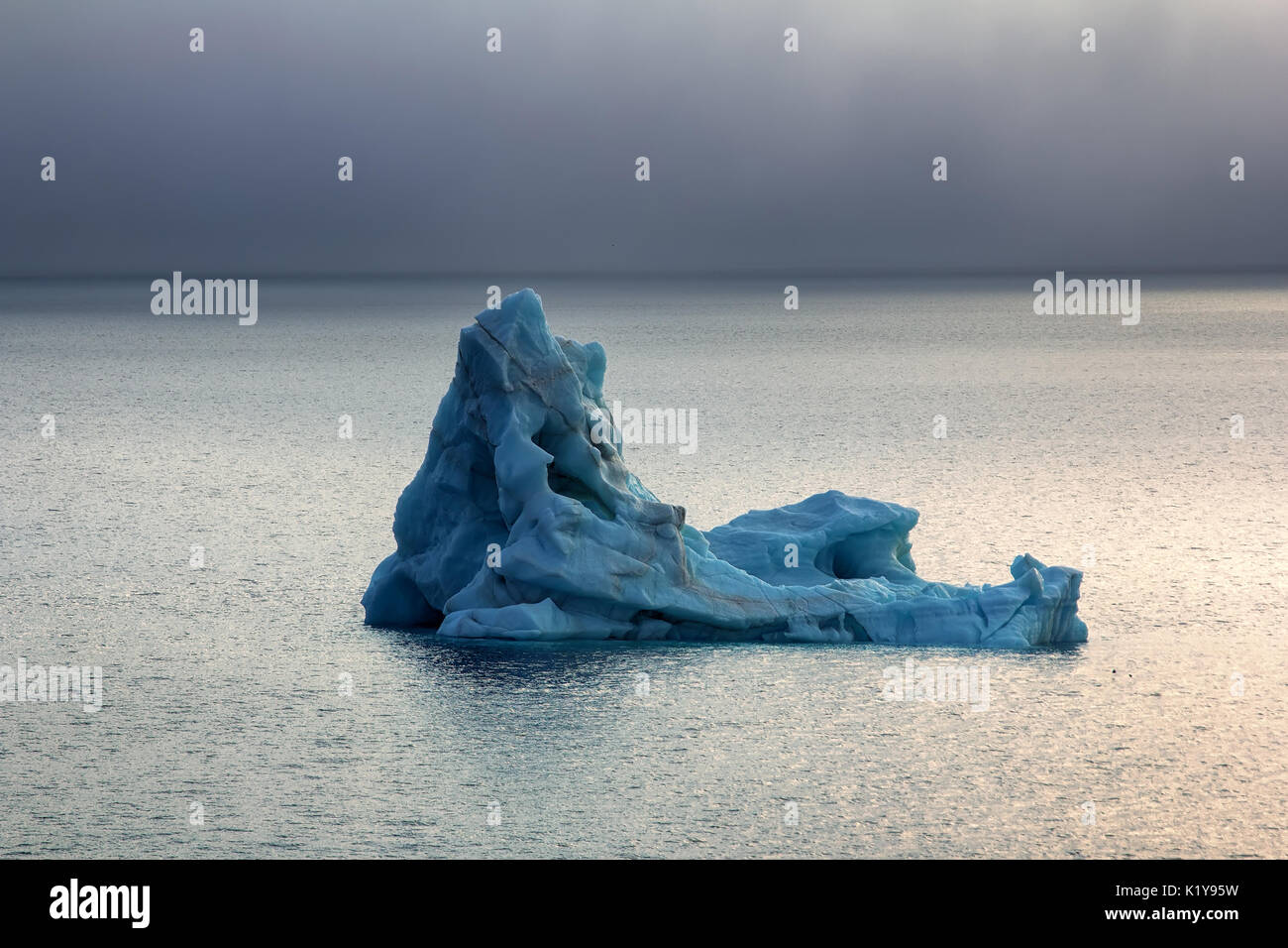Bergy bit - part of iceberg. Ship sails in immediate vicinity Stock ...