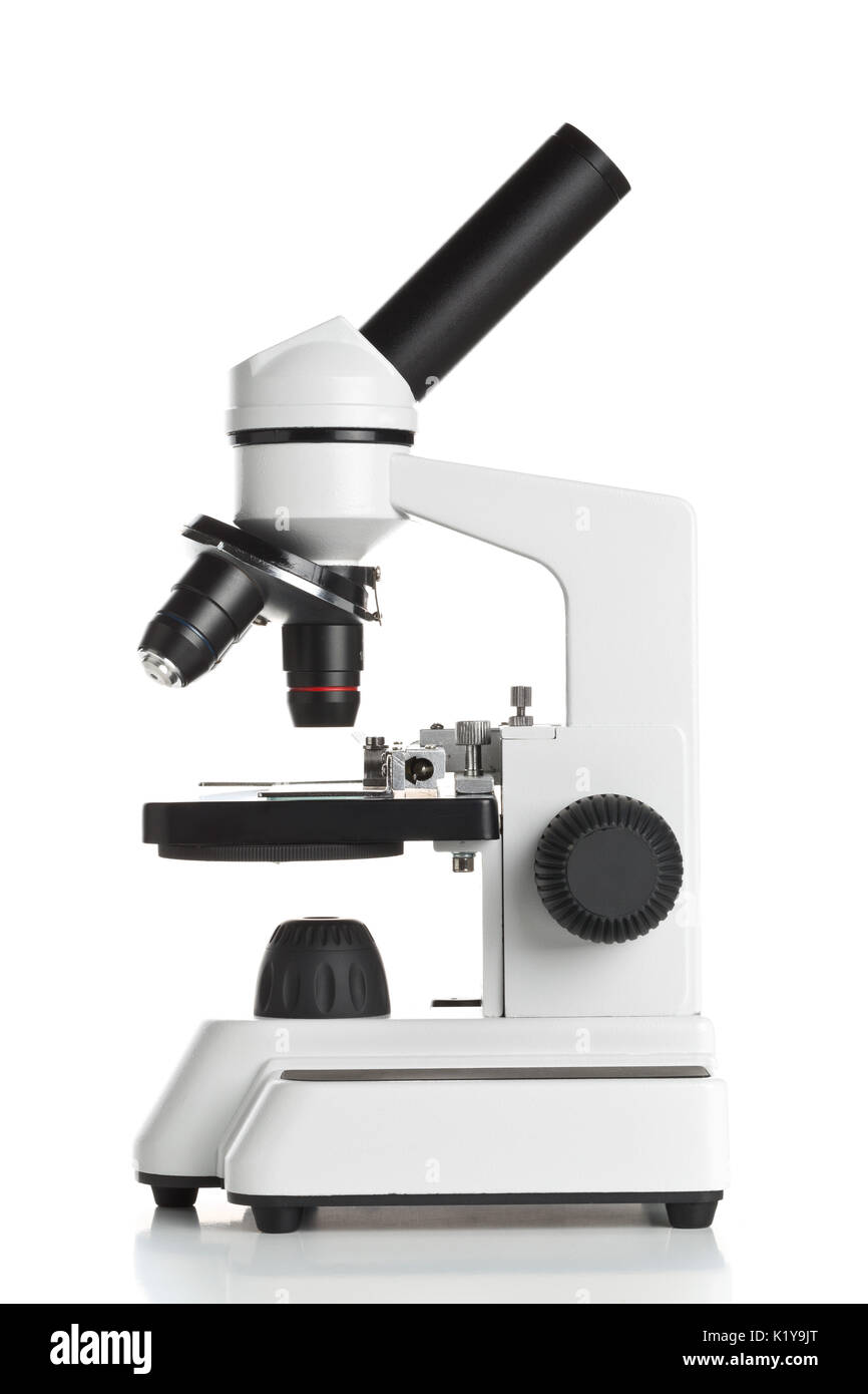 White microscope on table over white background Stock Photo - Alamy