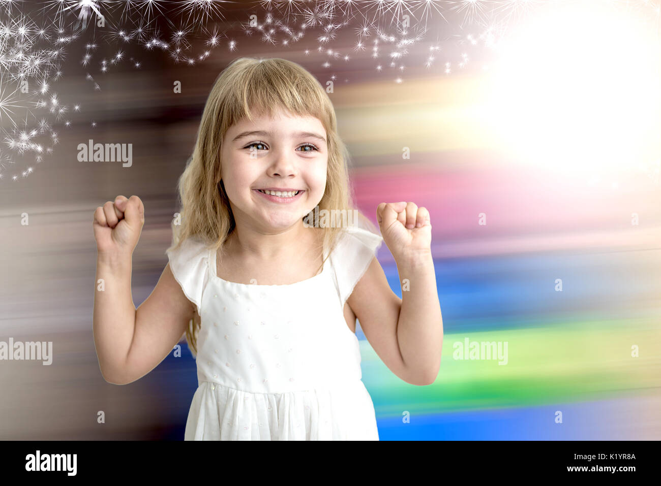 smiling child girl with hands up isolated on background Stock Photo - Alamy
