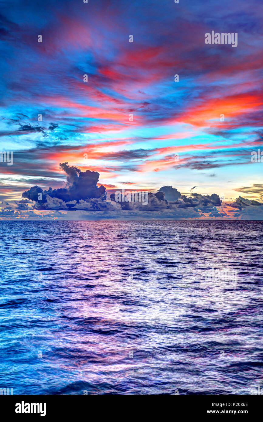 Sunset over the sea, cloud sky, Gangehi Island, Ari Atoll, Indian Ocean ...