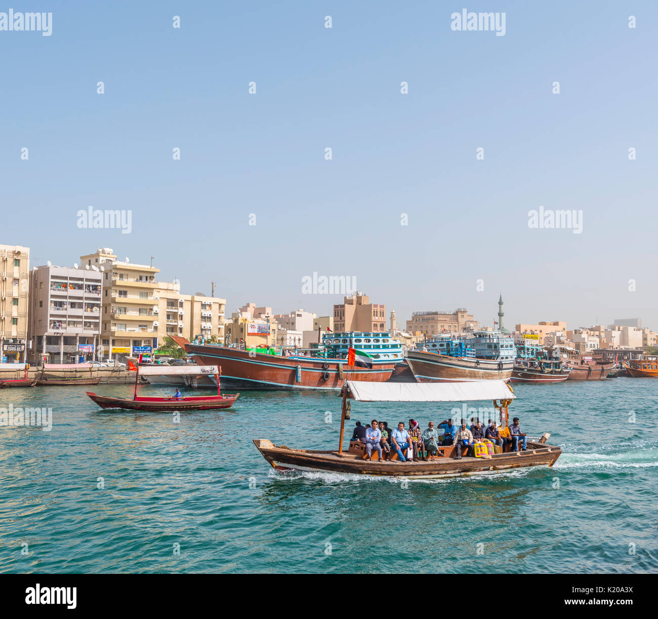 Small traditional ships and old dhow on the creek, Old Dubai, United ...