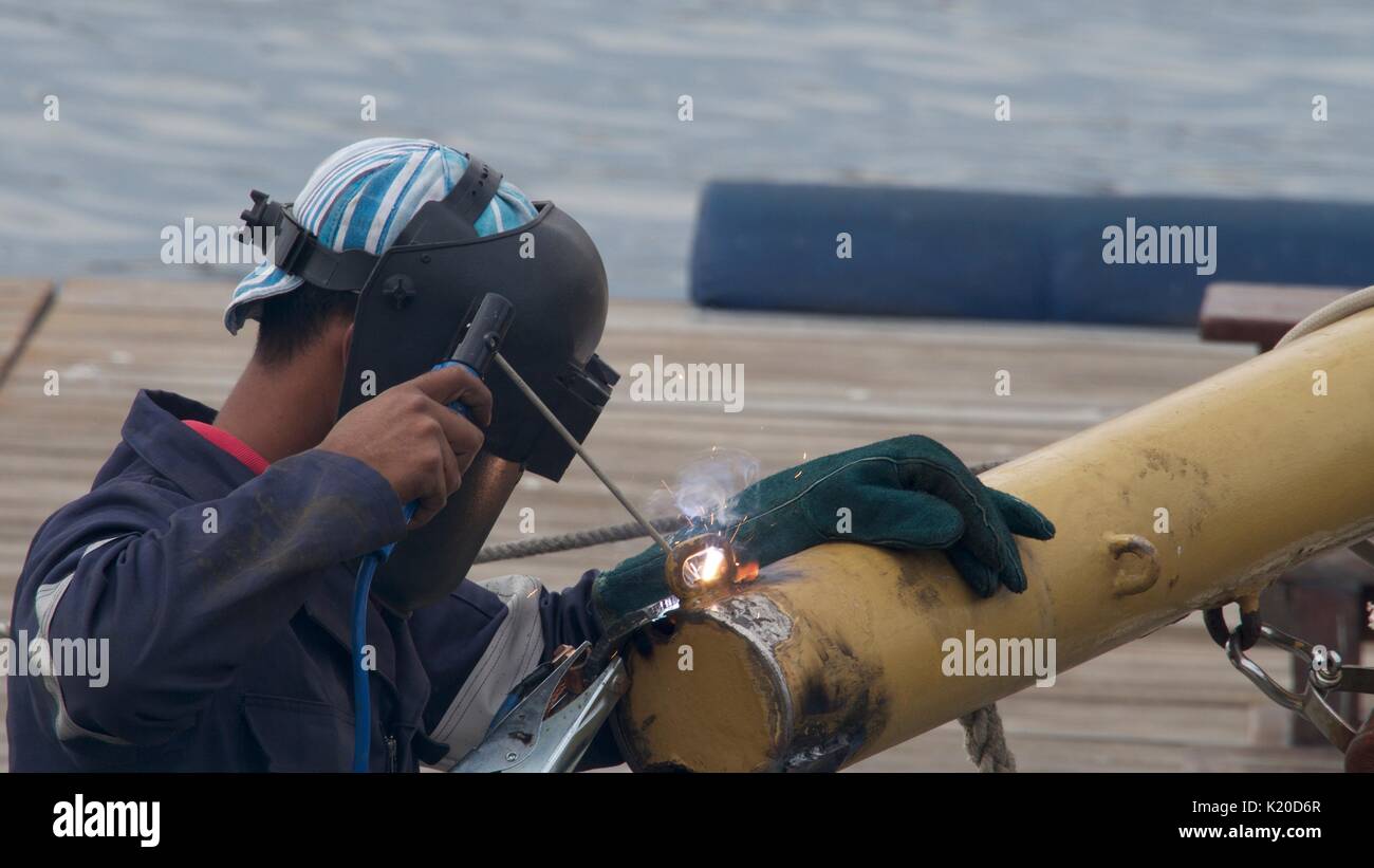 Welding on a sailboat Stock Photo - Alamy