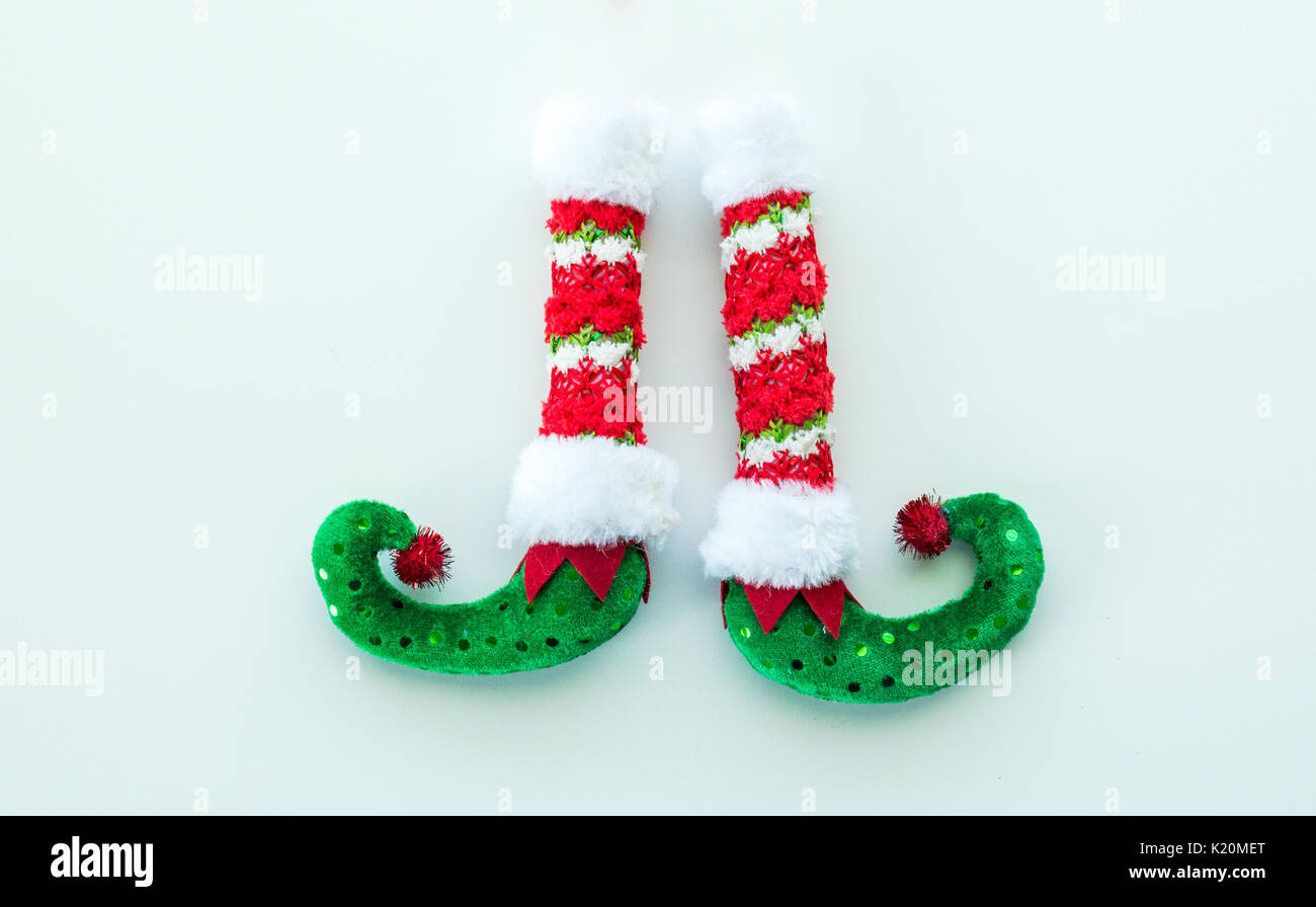 red and green Christmas elf boots isolated on white Stock Photo - Alamy