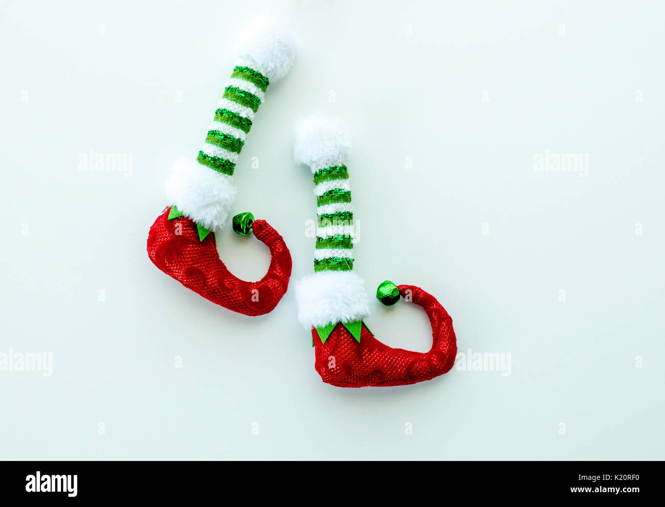 red and green Christmas elf boots isolated on white Stock Photo - Alamy