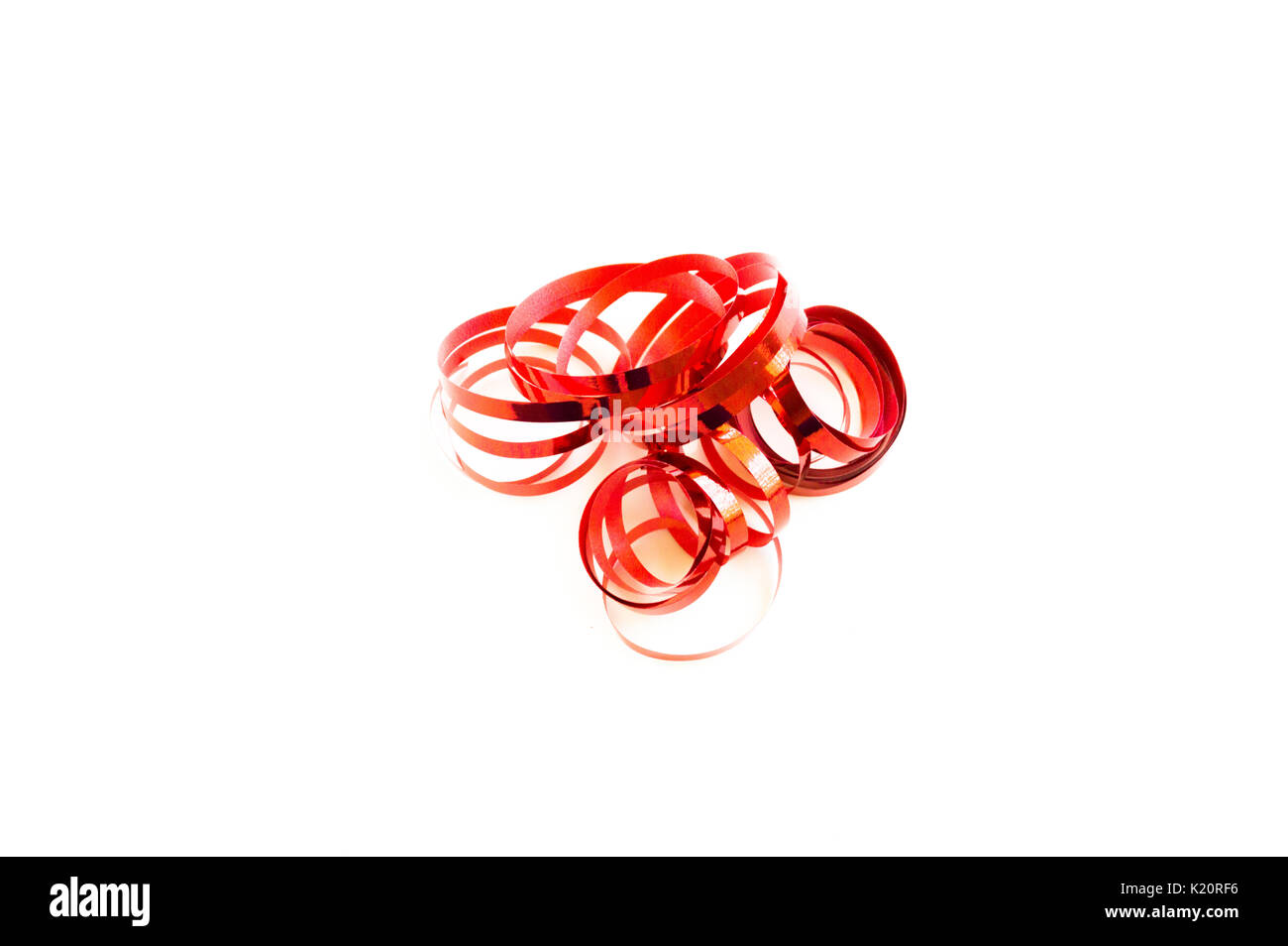 shiny red curling ribbon isolated on white Stock Photo - Alamy