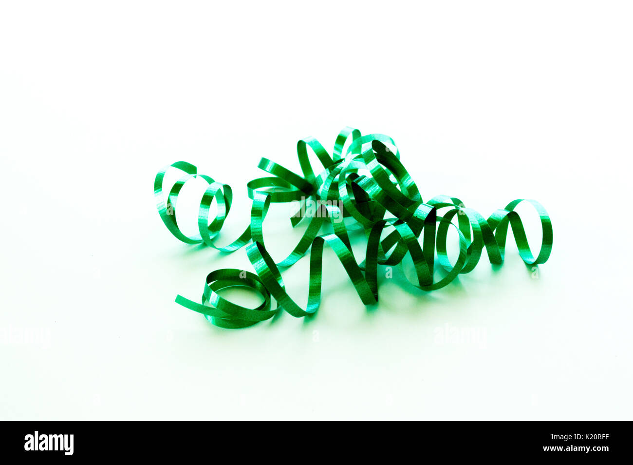 shiny green curling ribbon isolated on white Stock Photo - Alamy
