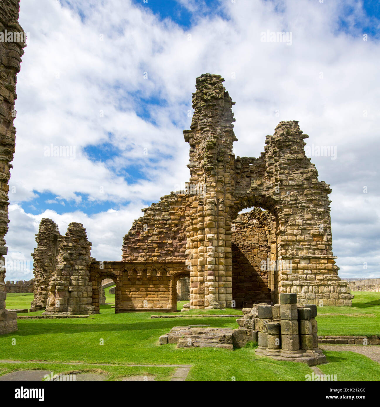 Ruins of historic Tynemouth castle and priory under blue sky, England ...