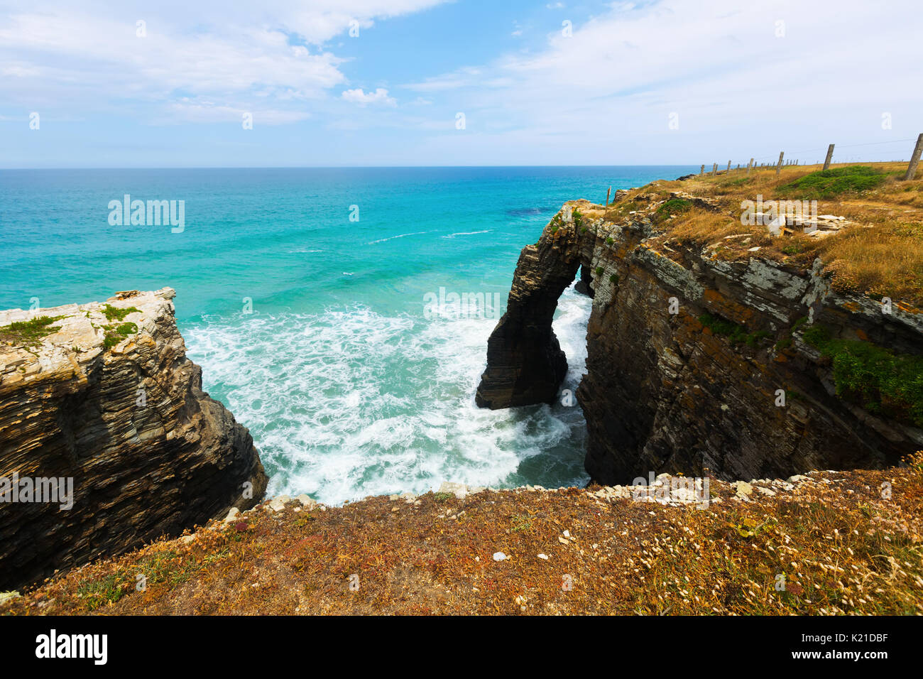 Natural arch at As Catedrais beach in summer day. Atlantic Ocean coast ...