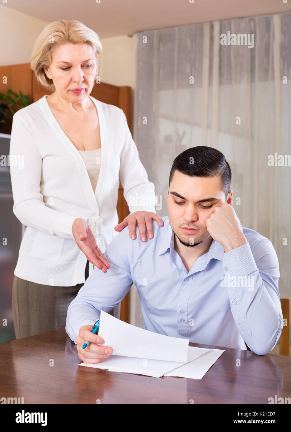 Sad senior woman young boyfriend hi-res stock photography and images ...