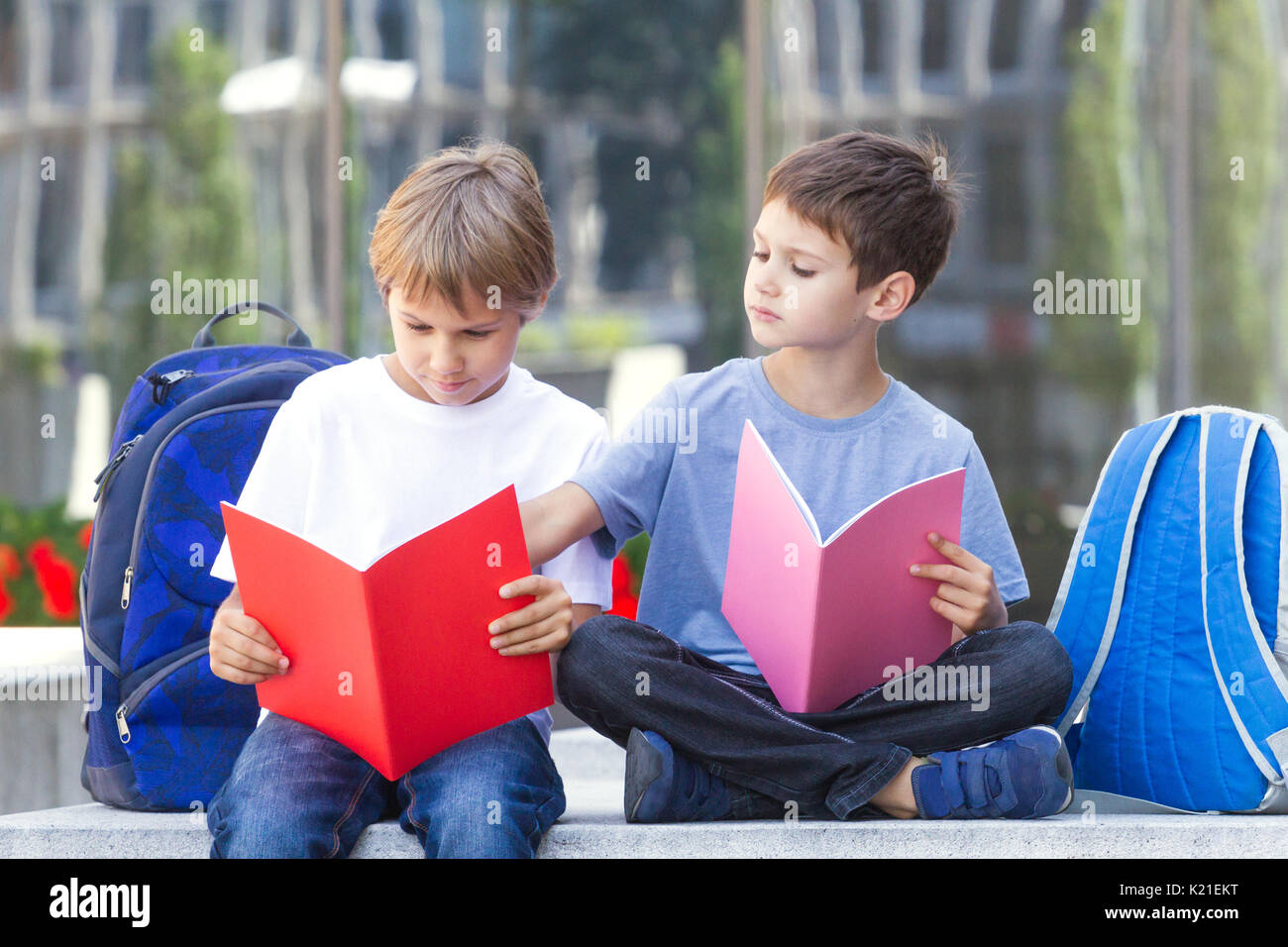 Children doing homework outdoors Stock Photo - Alamy
