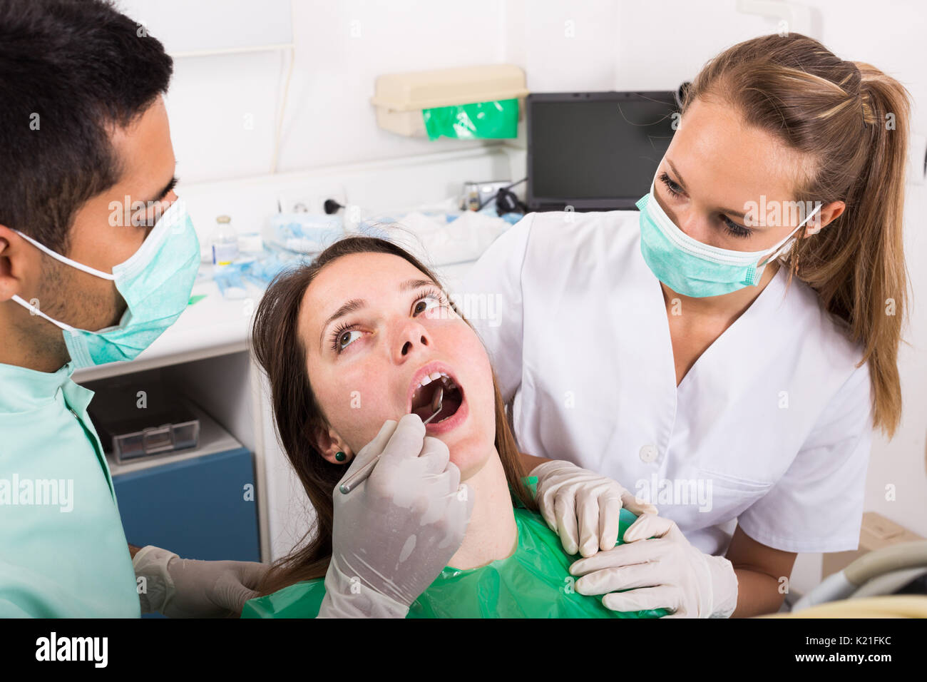 Scared patient treating at the dental hospital Stock Photo - Alamy