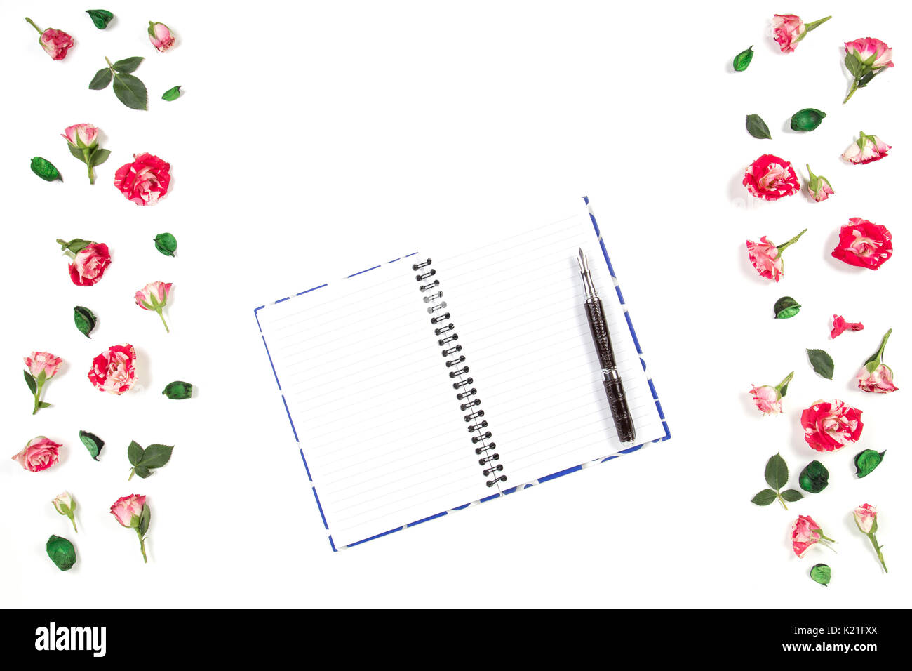 Open paper notebook and rose frame. Flat lay, top view Stock Photo - Alamy