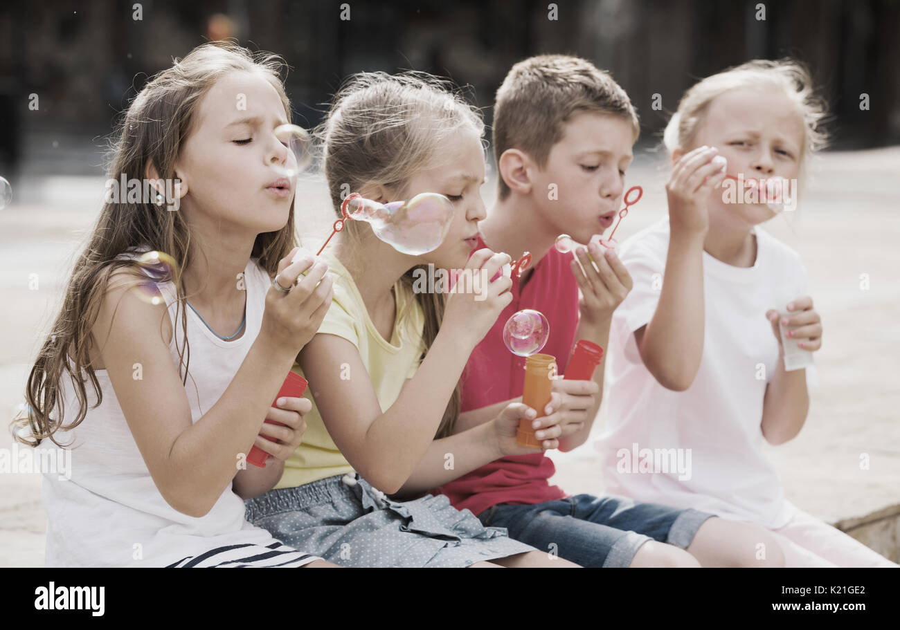 Boy girl blowing bubbles in hi-res stock photography and images - Alamy