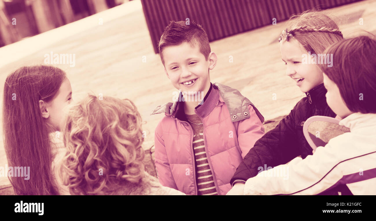 Positive smiling children holding hands and giving friendship vow Stock ...