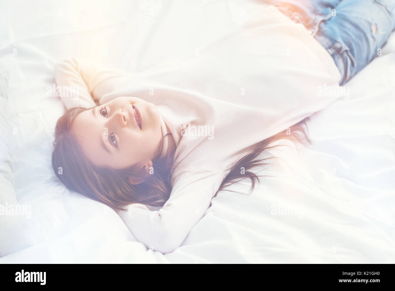 Lively cute girl feeling dreamy Stock Photo - Alamy