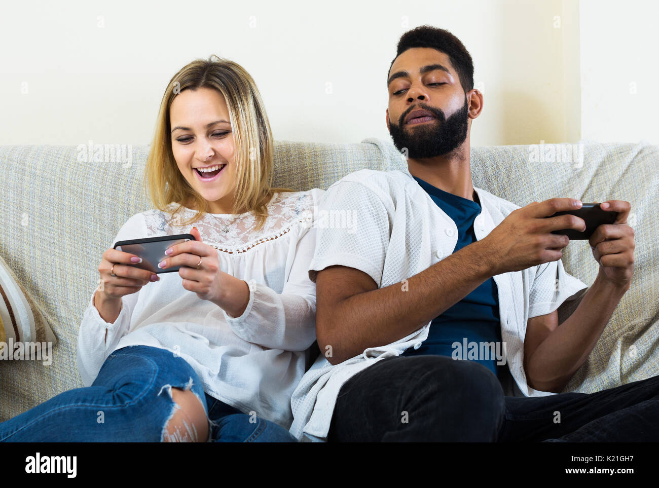 Interracial couple having problems becouse of mobile phones addiction ...