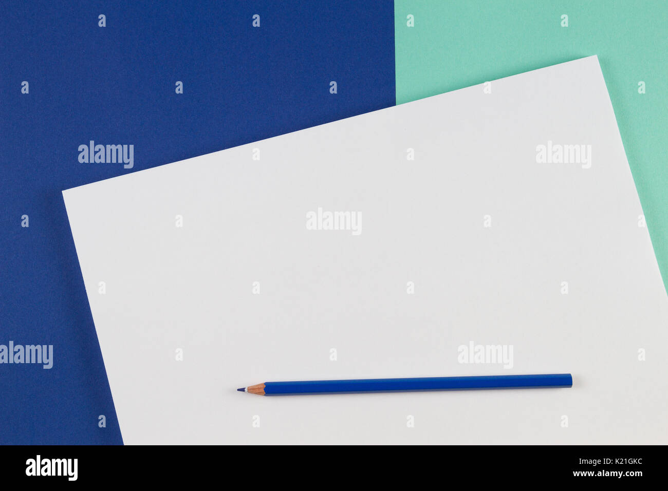 Blue colored pencils on blue color background Stock Photo - Alamy
