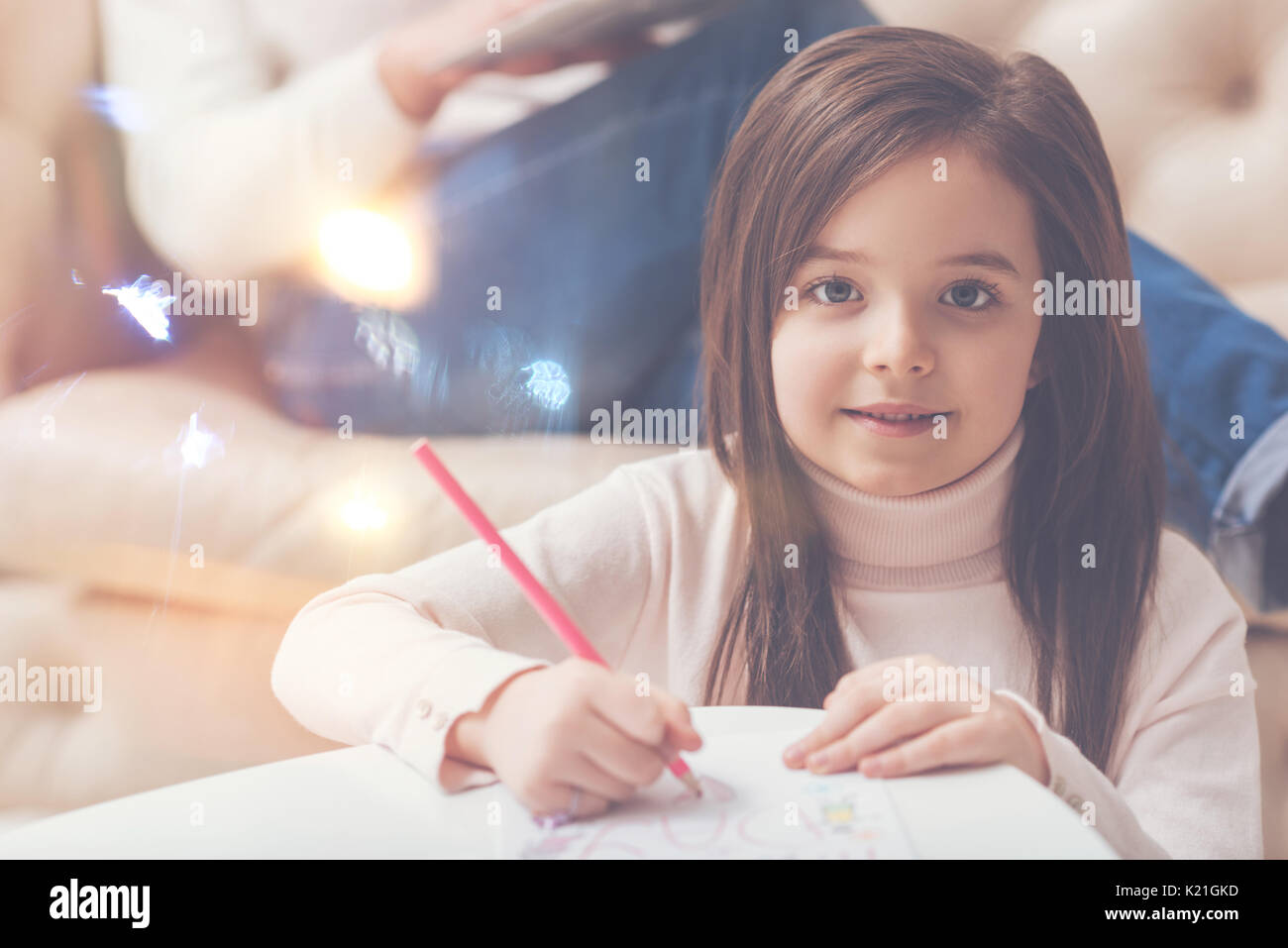 Talented persistent girl drawing something Stock Photo - Alamy