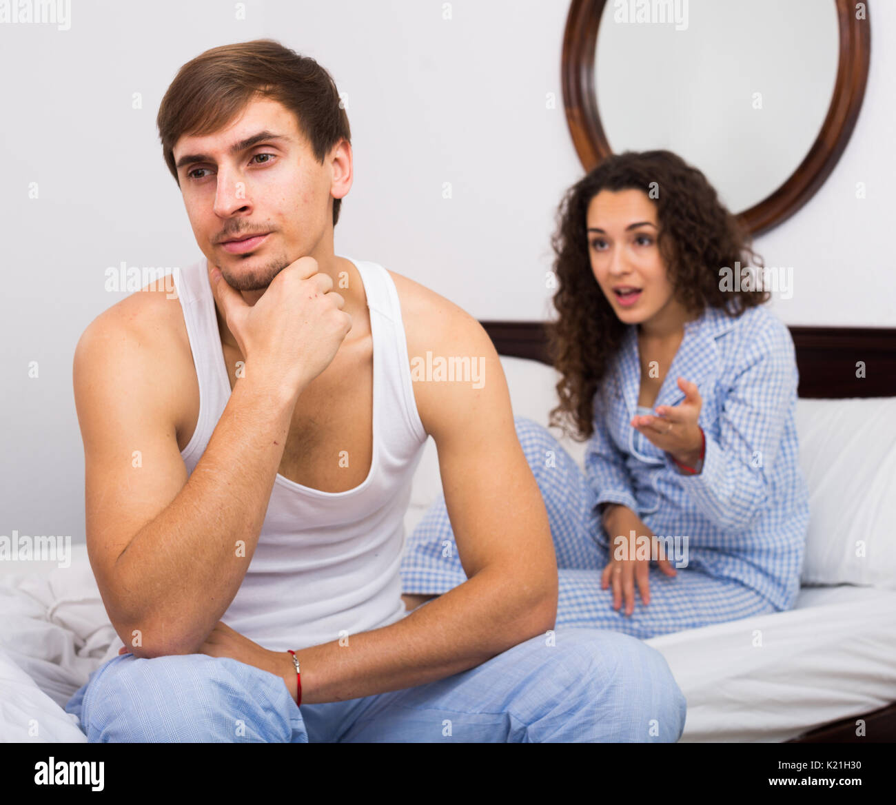 Husband turning away from wife during bad fight in bedroom Stock Photo ...