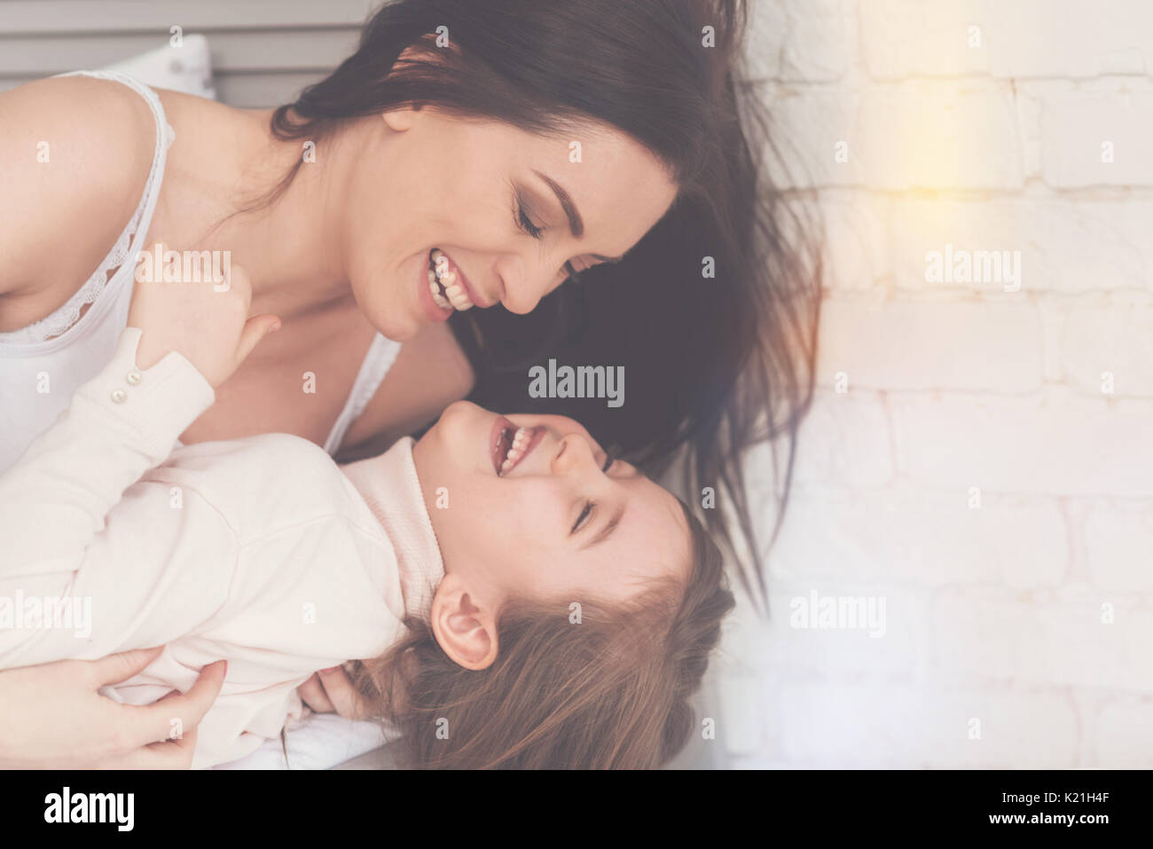 Adorable child and her mom sharing a happy moment Stock Photo - Alamy