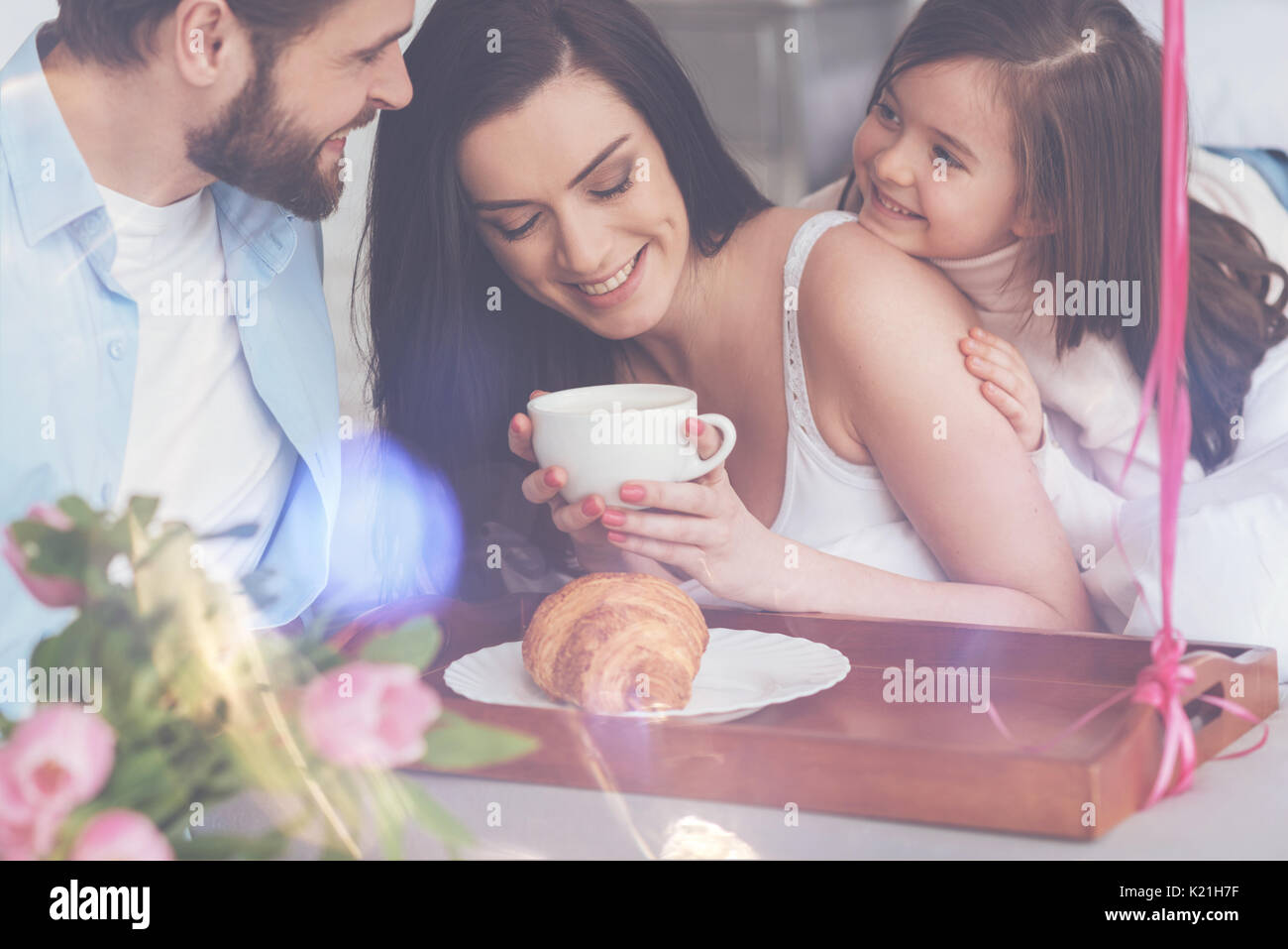 Optimistic excited young family experiencing a great morning Stock ...