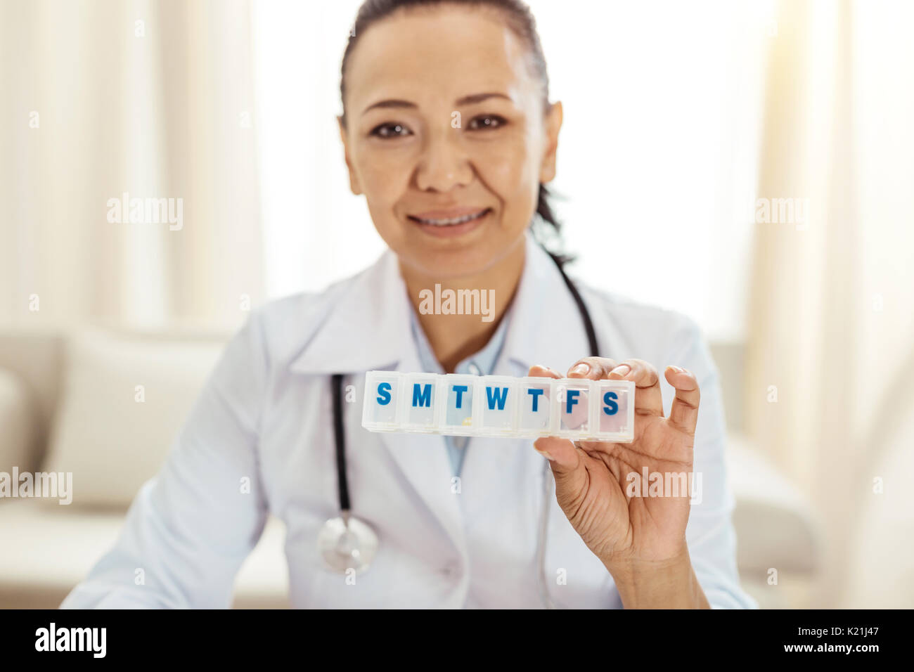 Box with medicine being held by a doctor Stock Photo - Alamy