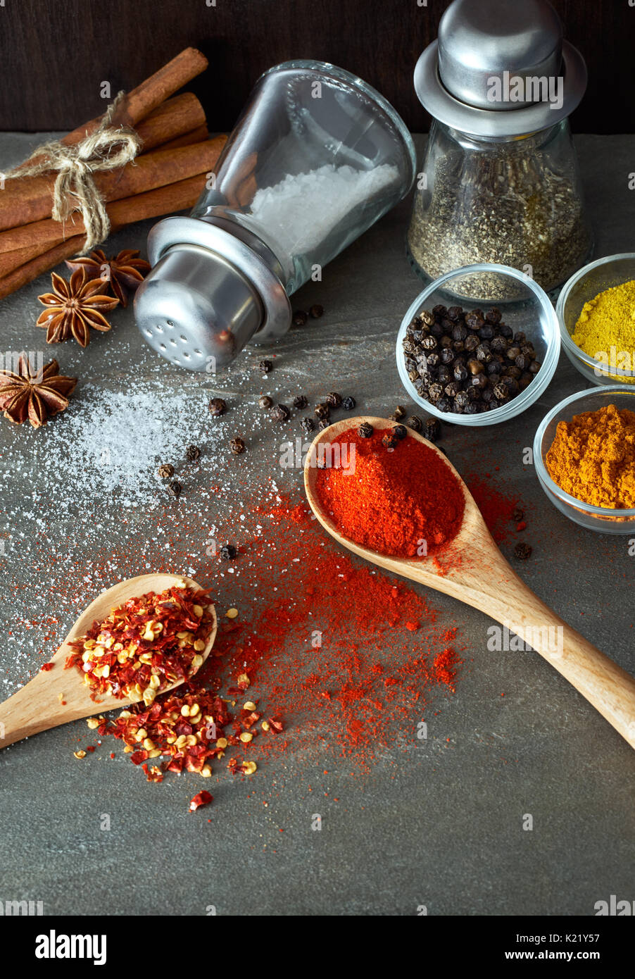 Clashing spices from spoon and other kitchen utensils Stock Photo - Alamy
