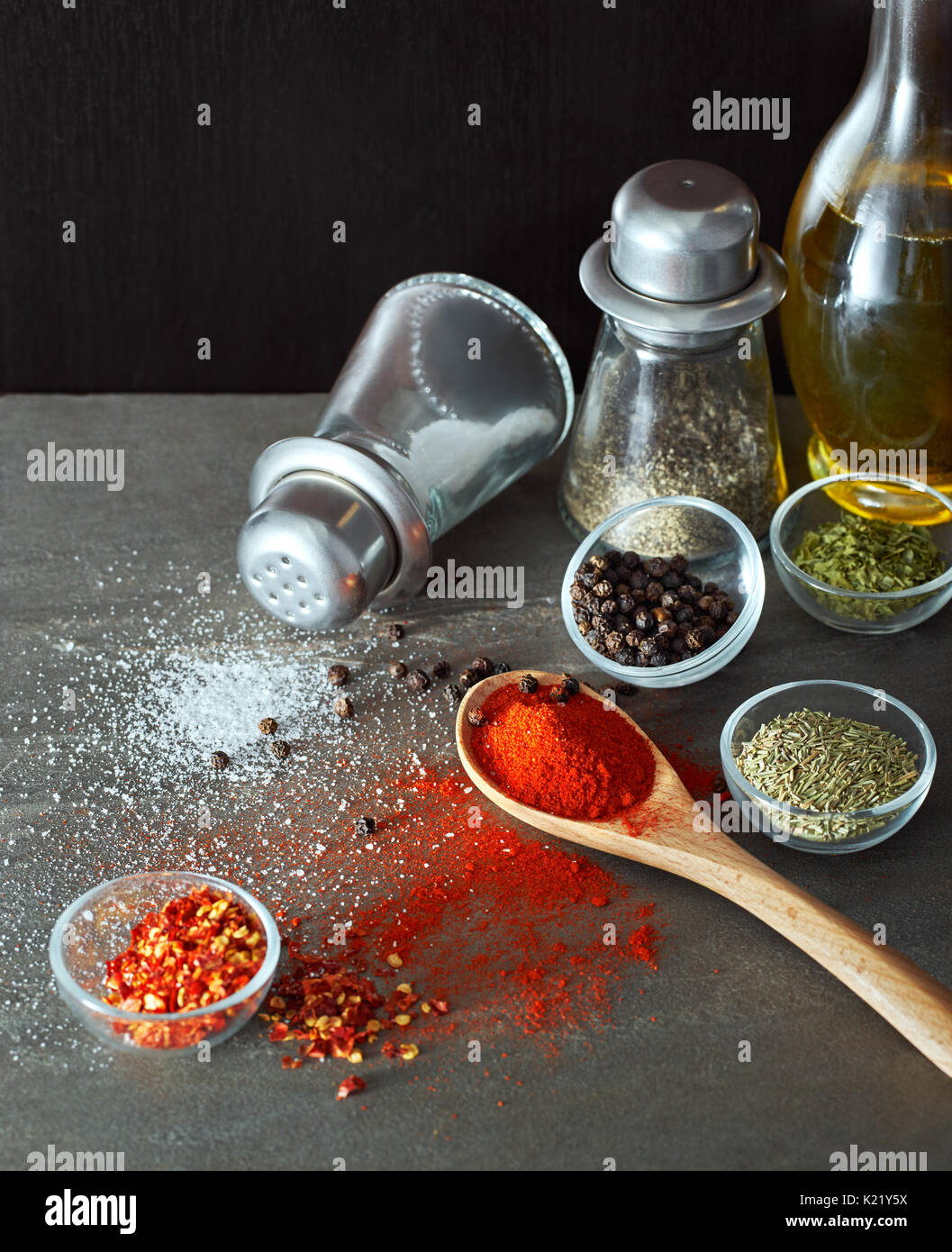 Clashing spices from spoon and other kitchen utensils Stock Photo - Alamy