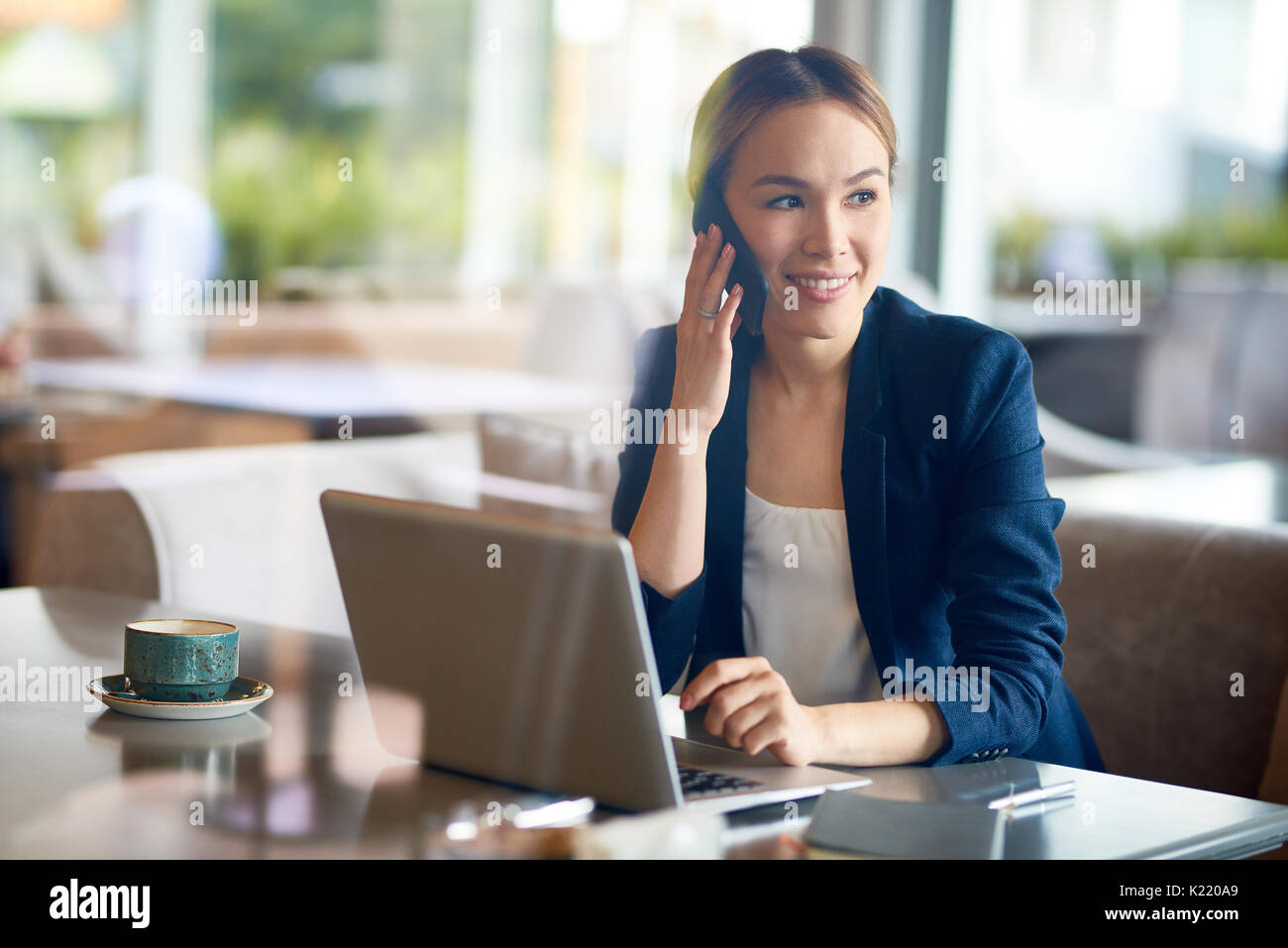 Pretty Entrepreneur Working at Cafe Stock Photo - Alamy