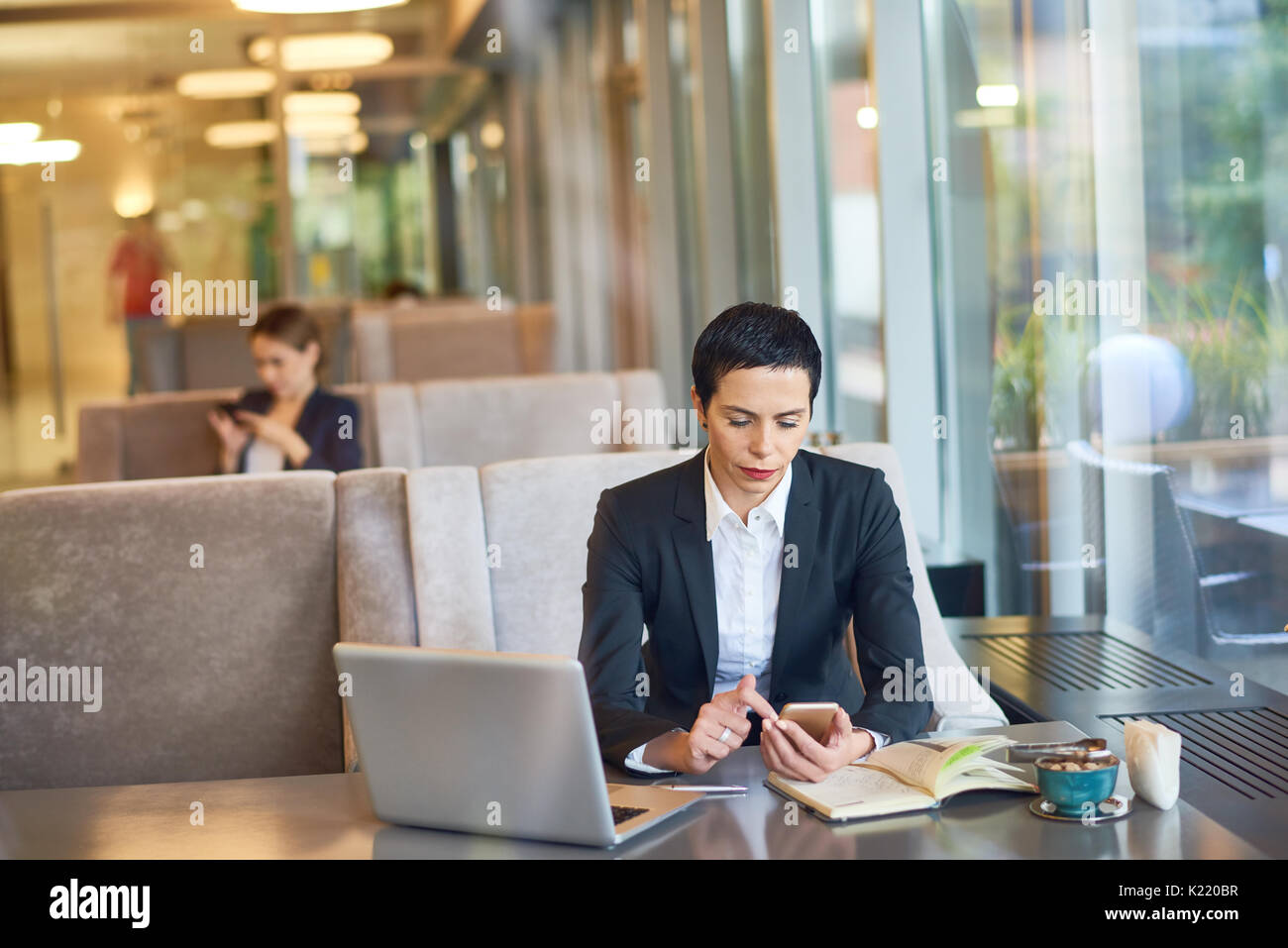Pretty Entrepreneur with Smartphone Stock Photo - Alamy