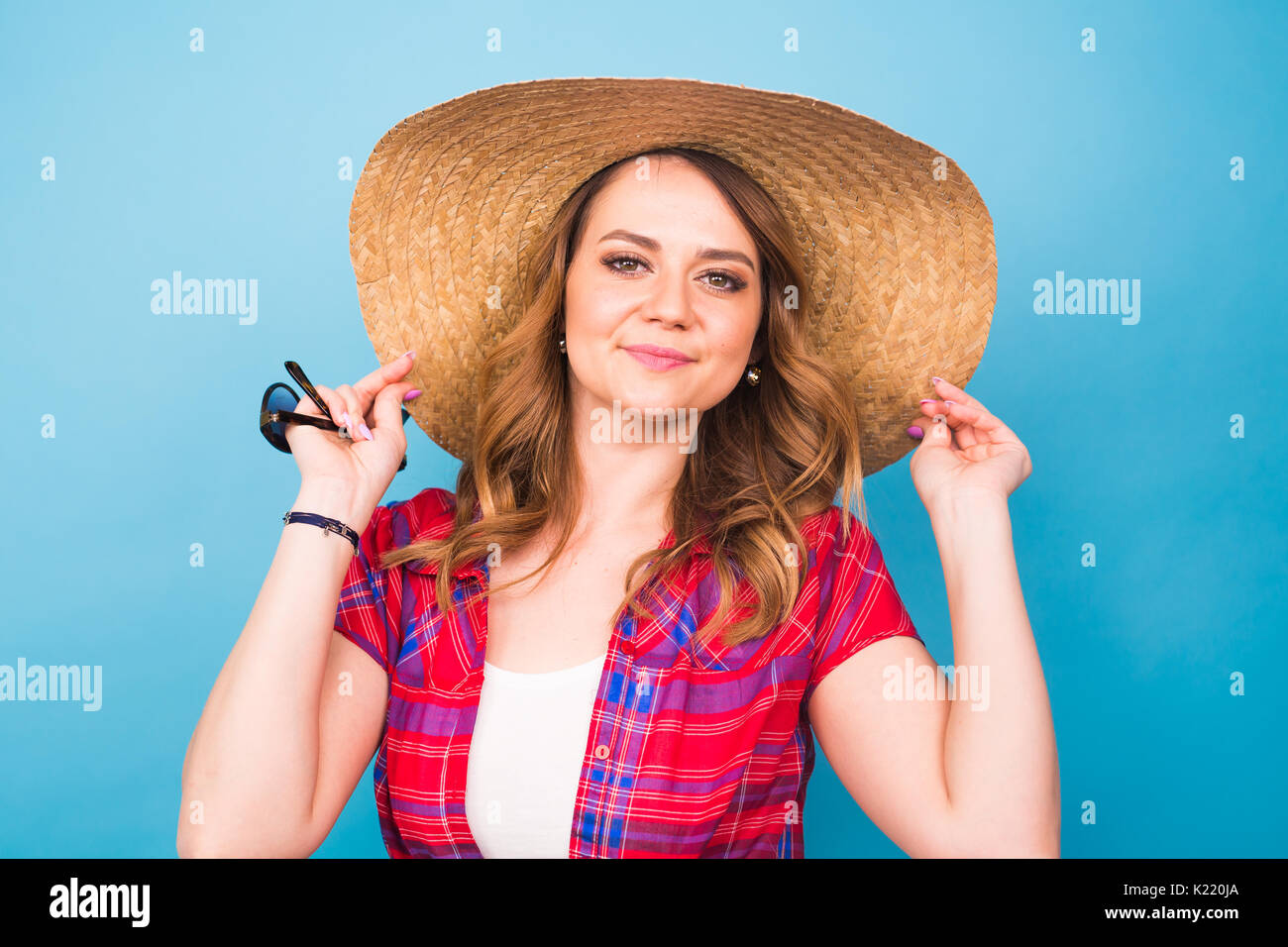 Beautiful woman in hat in studio, back view Stock Photo - Alamy
