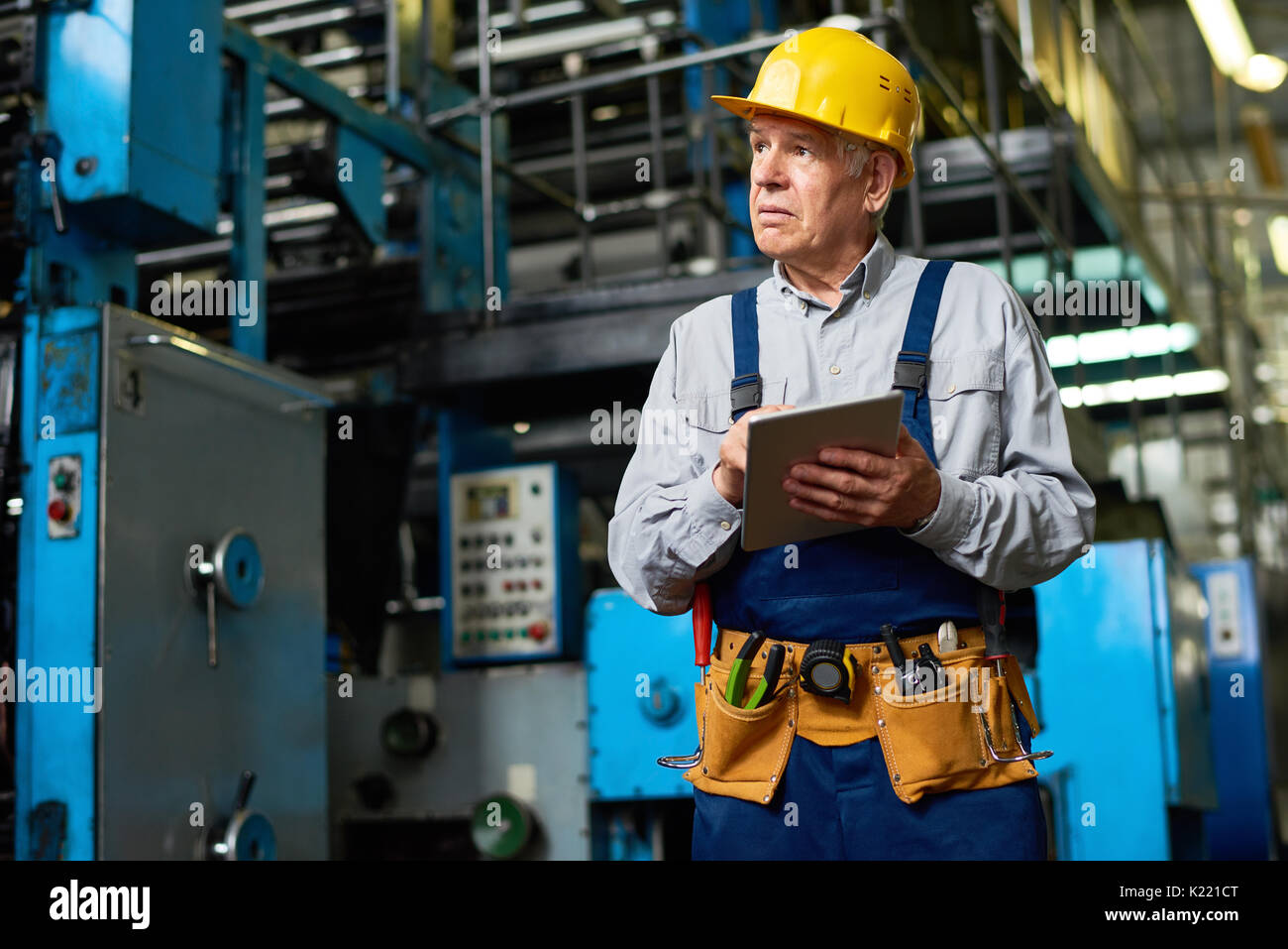 Senior Factory Worker Using Tablet Stock Photo - Alamy