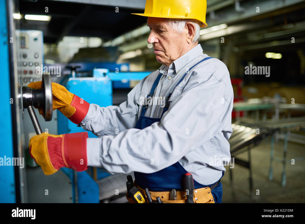 Senior Mechanic Fixing Machines at Factory Stock Photo - Alamy
