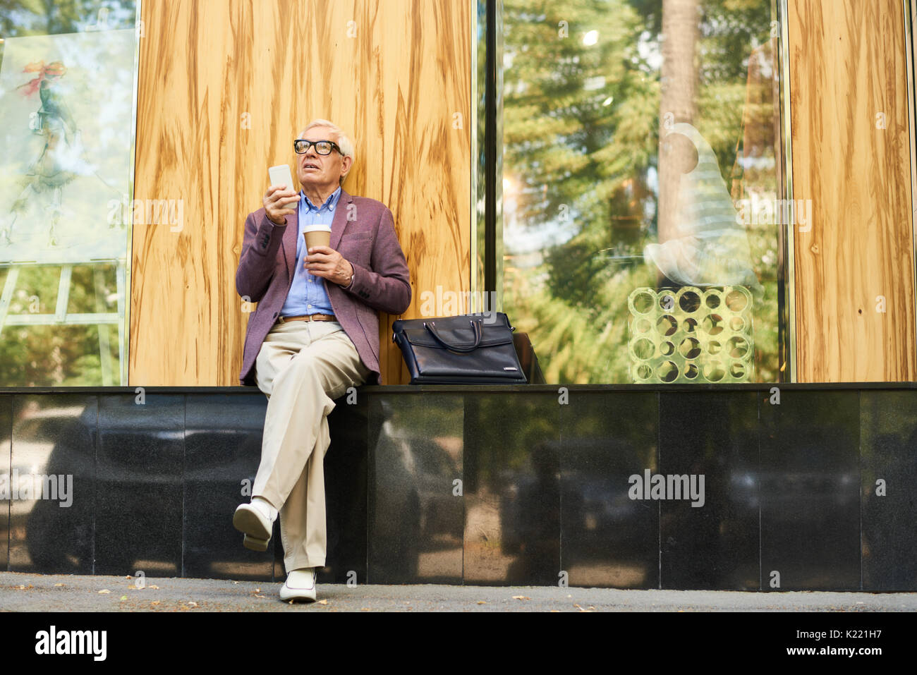 Stylish senior man holding hi-res stock photography and images - Alamy
