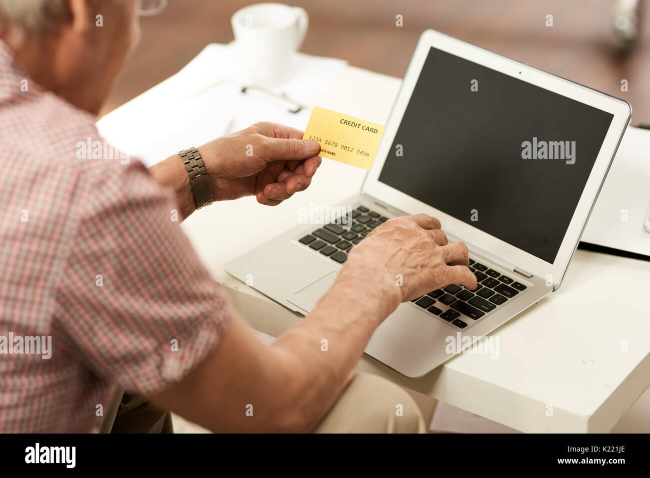 Senior Man Paying with Credit Card Stock Photo - Alamy