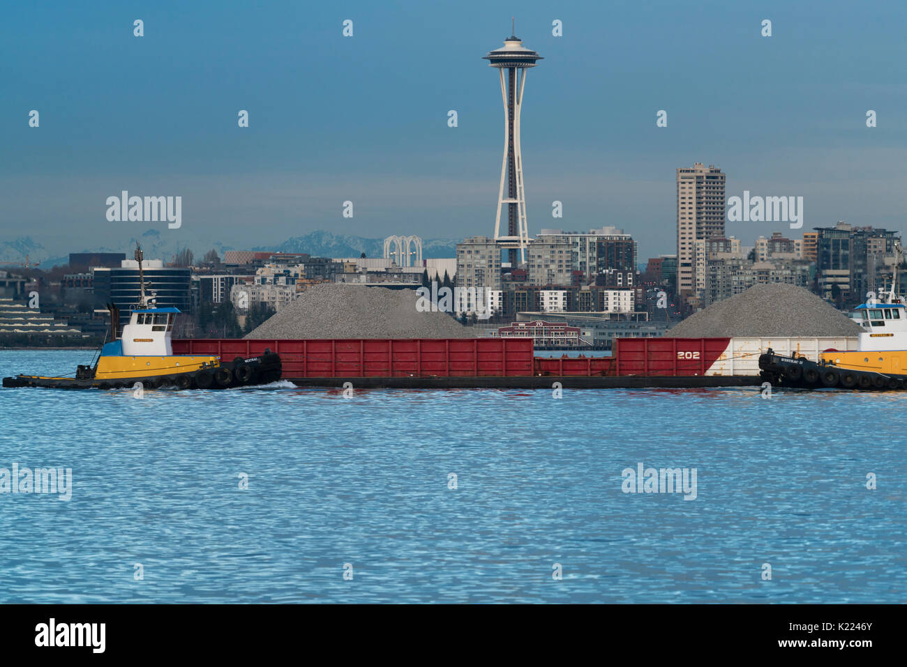 Tugboat pulling barges into the port of Seattle, Washington, USA Stock ...