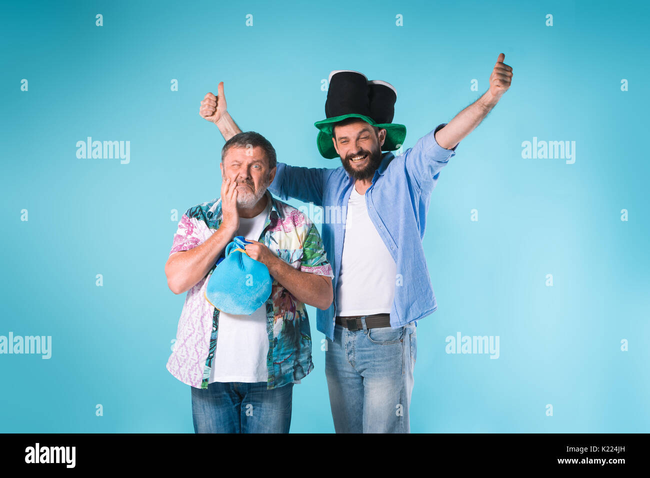 The two football fans over blue Stock Photo - Alamy