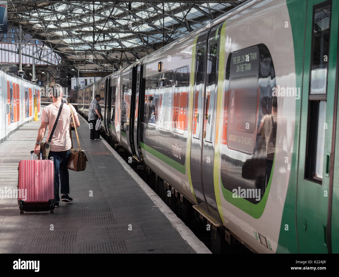 Passengers boarding London Midland train at Liverpool Lime Street Station, Liverpool, England ...