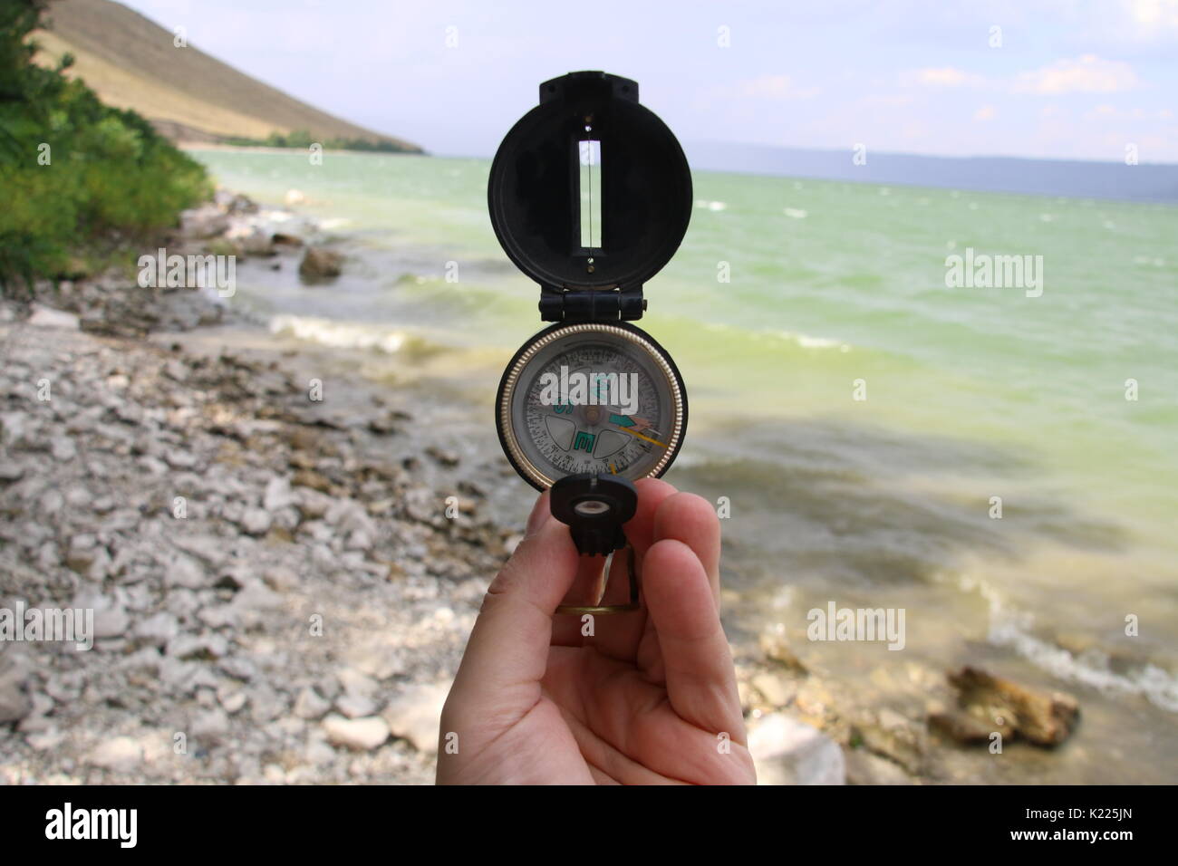 Tourist compass in hand hi-res stock photography and images - Alamy