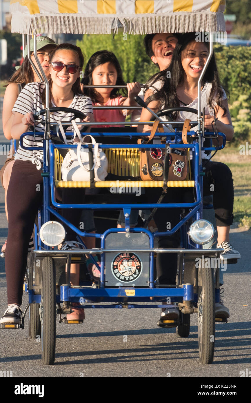 People having a good time pedaling a car, Alki Beach, Seattle ...
