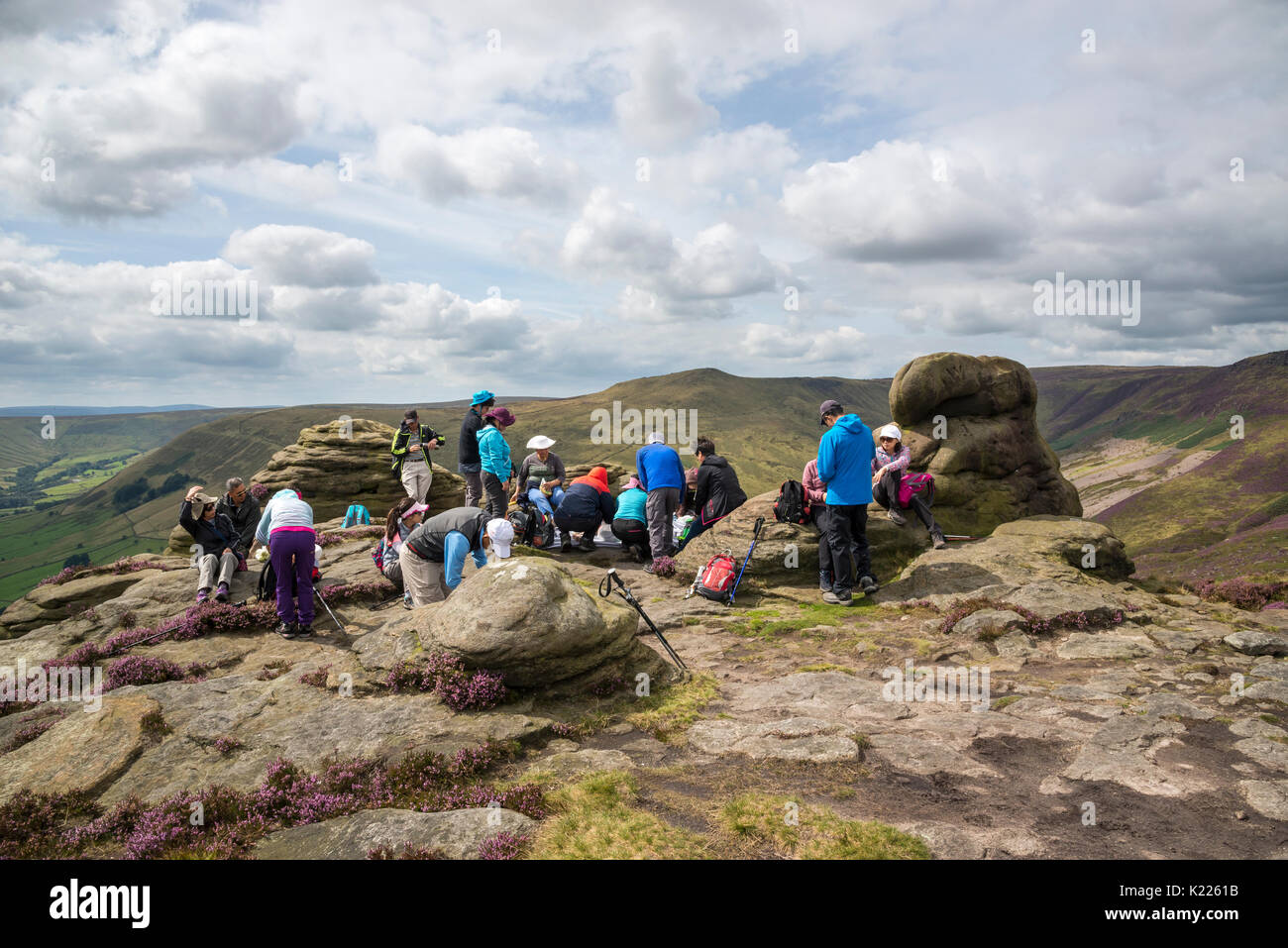 Group of foreign tourists enjoying the Peak District landscape at ...