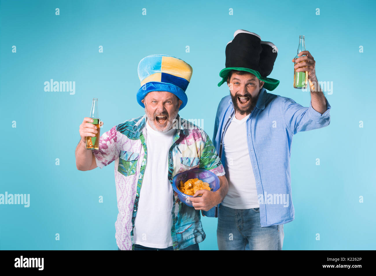 The two football fans over blue Stock Photo - Alamy