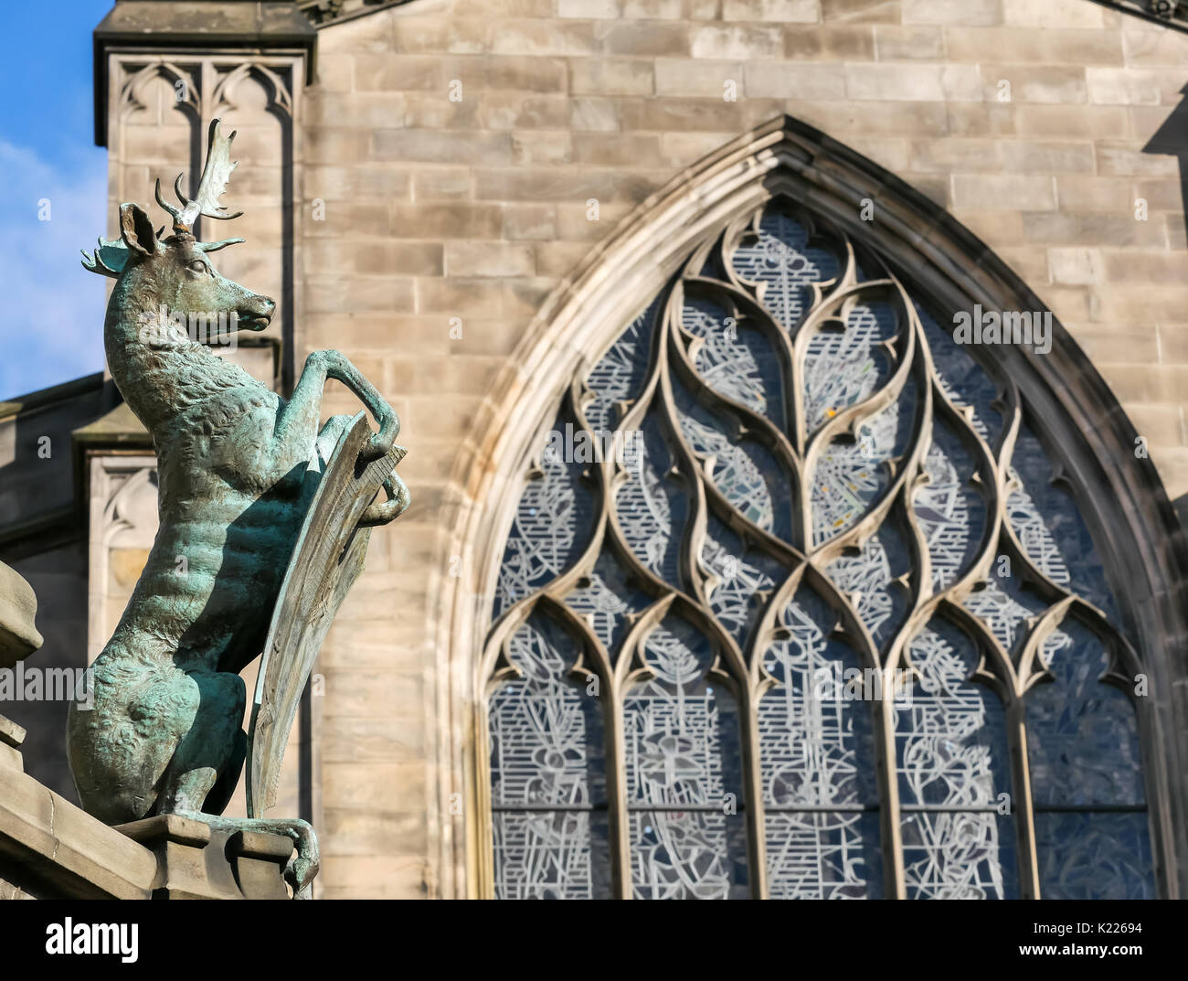 Bronze stag or deer statue on monument in front of St Giles cathedral ...