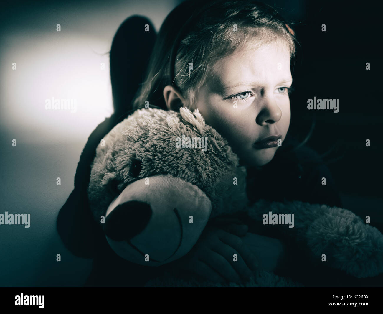 Sad child hugging friend hi-res stock photography and images - Alamy