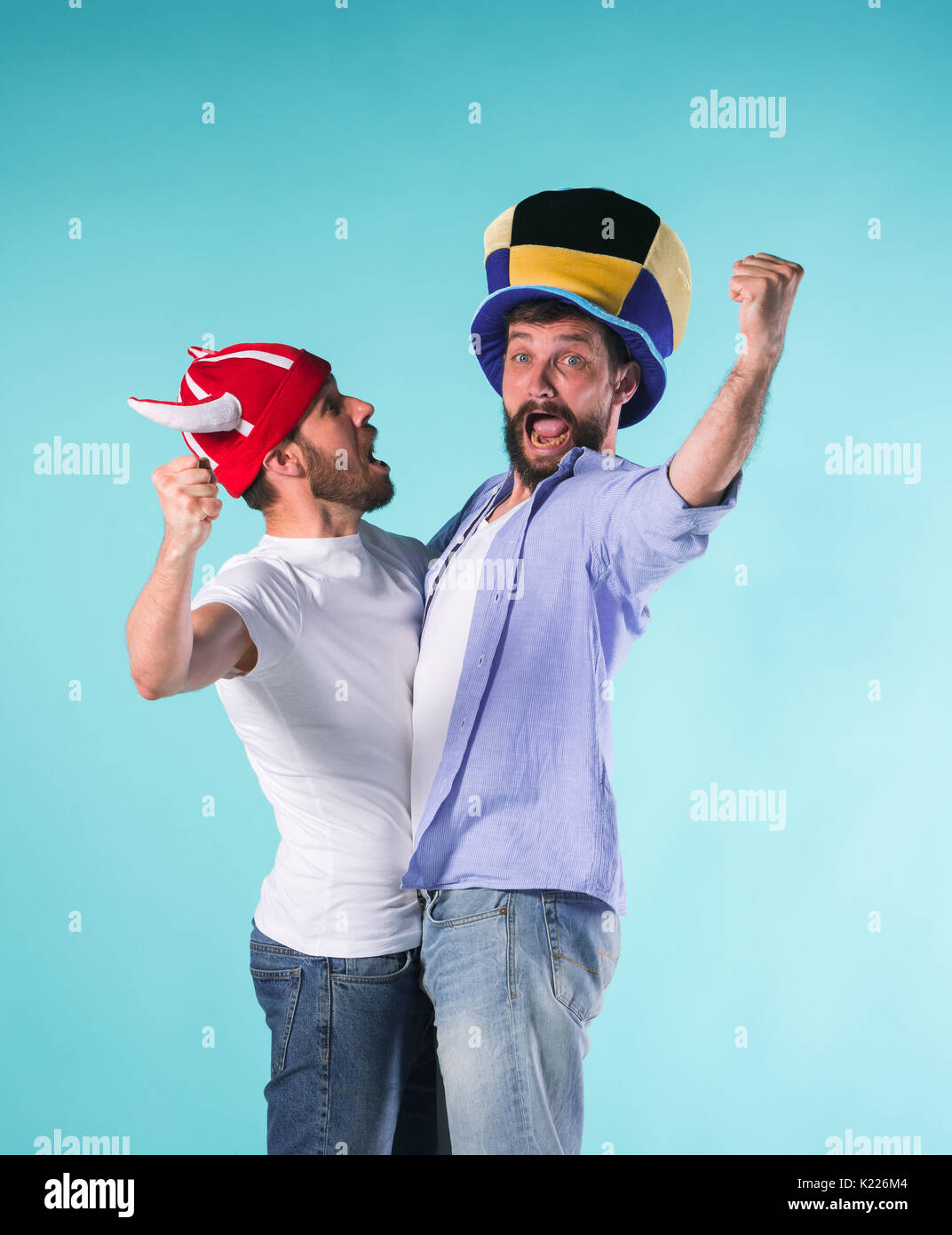 Two Excited Male Friends Celebrate Watching Sports Stock Photo - Alamy