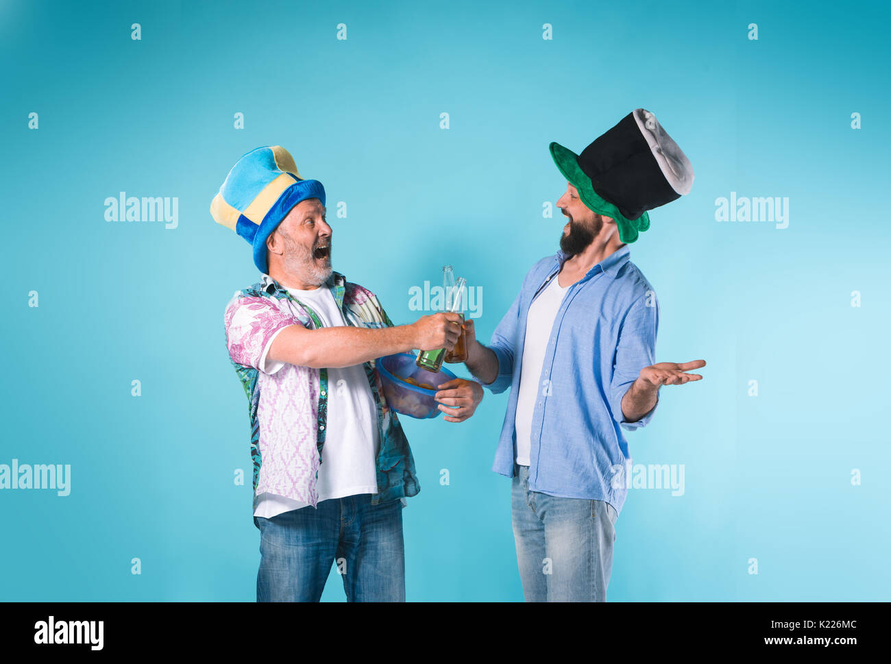 The two football fans over blue Stock Photo - Alamy