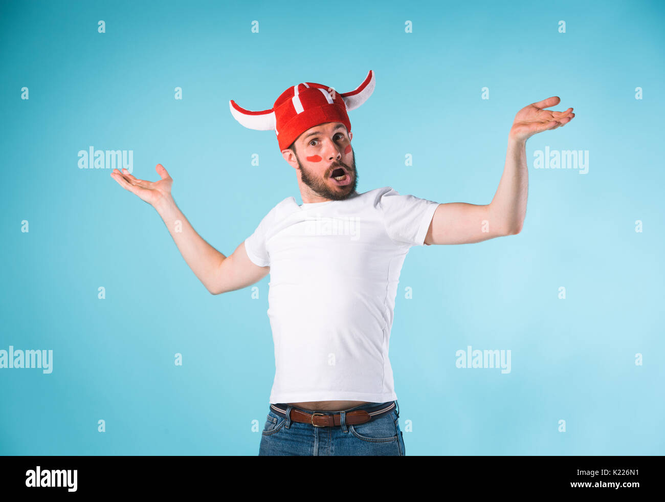 The football fan over blue Stock Photo - Alamy